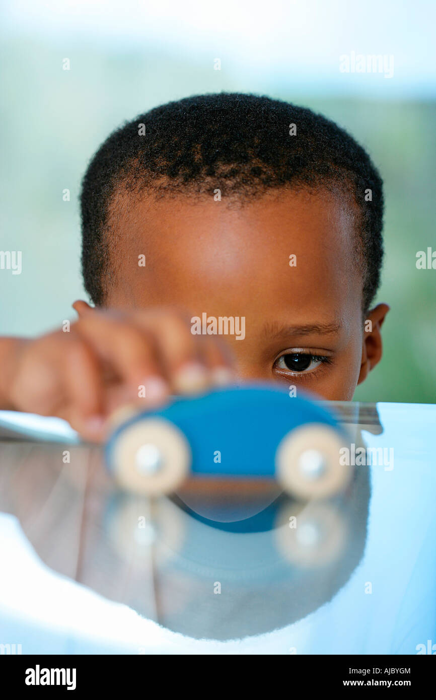 African boy playing toy car hi-res stock photography and images - Alamy