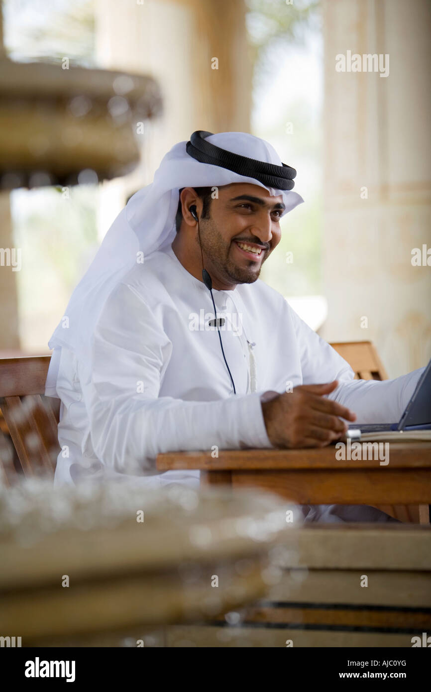 Smiling Arab Business Man Working on Laptop Computer Stock Photo - Alamy