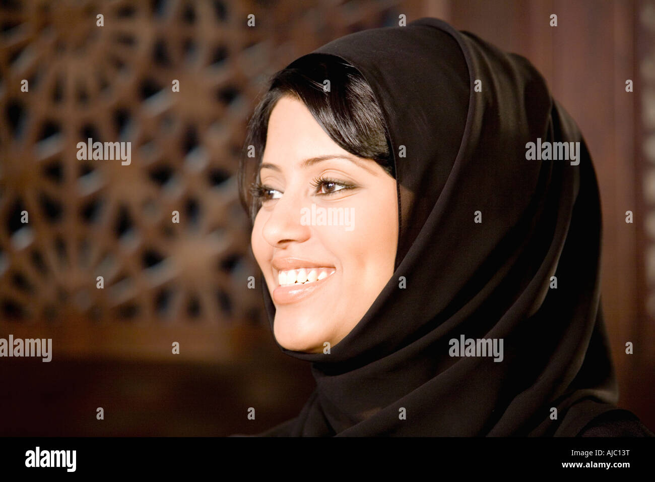 Arab Woman Smiling in Restaurant Stock Photo - Alamy