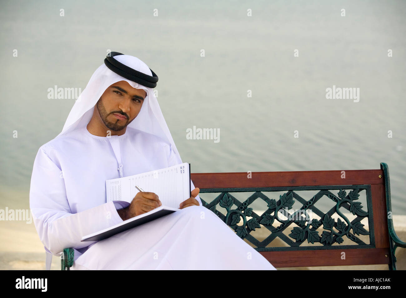 Arab man sitting on park hi-res stock photography and images - Alamy