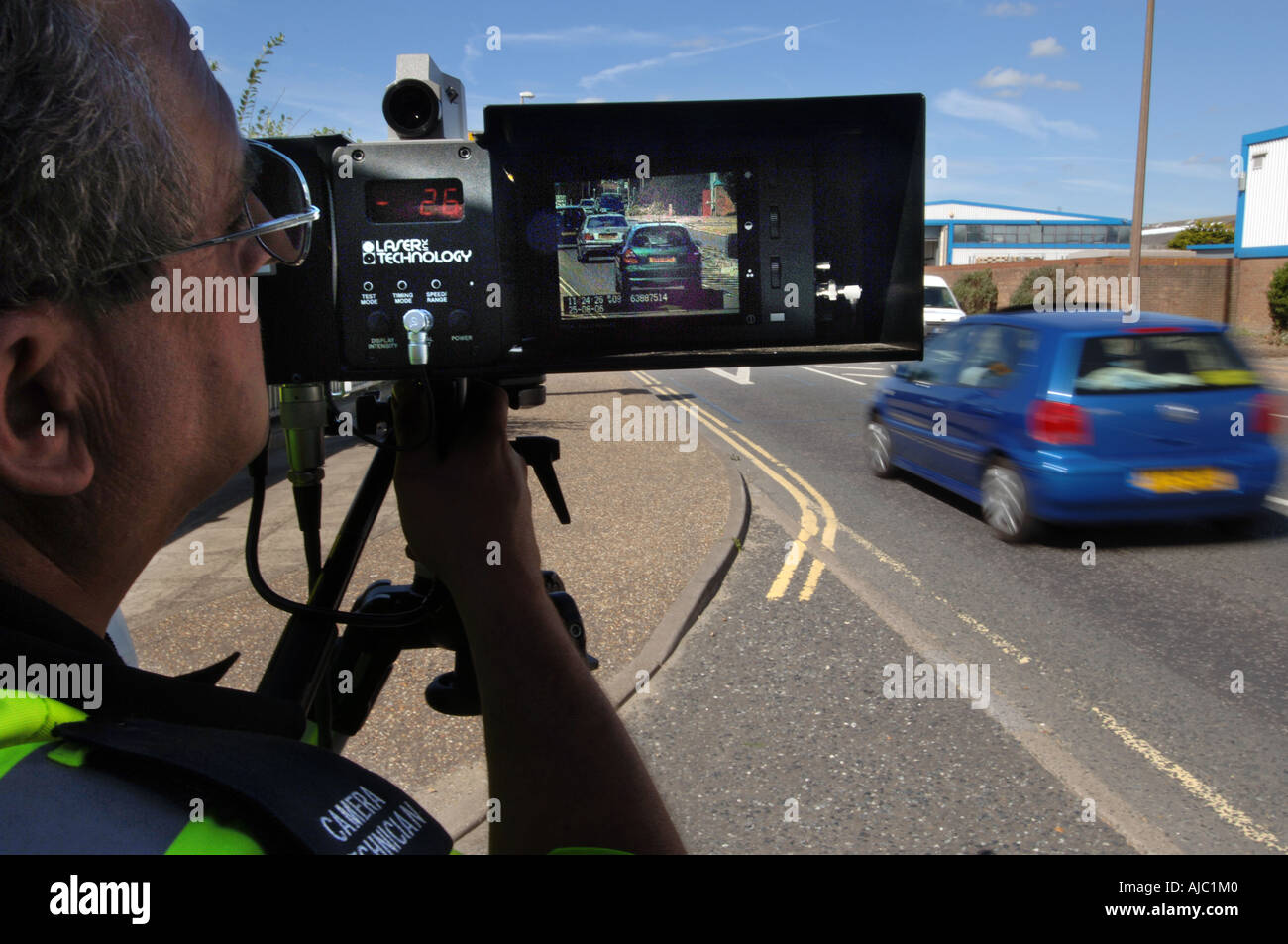 A Speed Safety Camera enforcement officer checks on speeding cars Stock ...