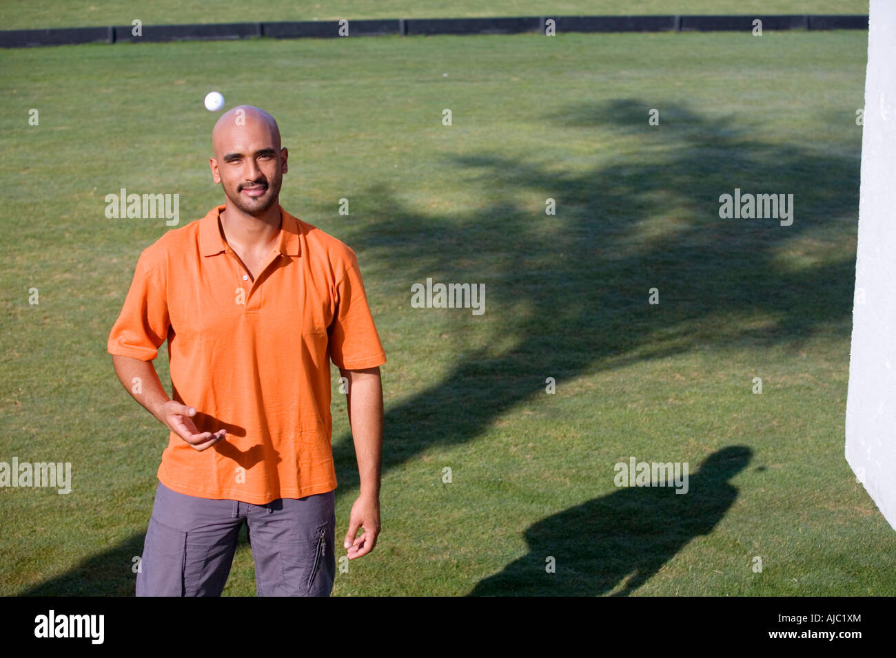 Man throwing golf ball air hi-res stock photography and images - Alamy