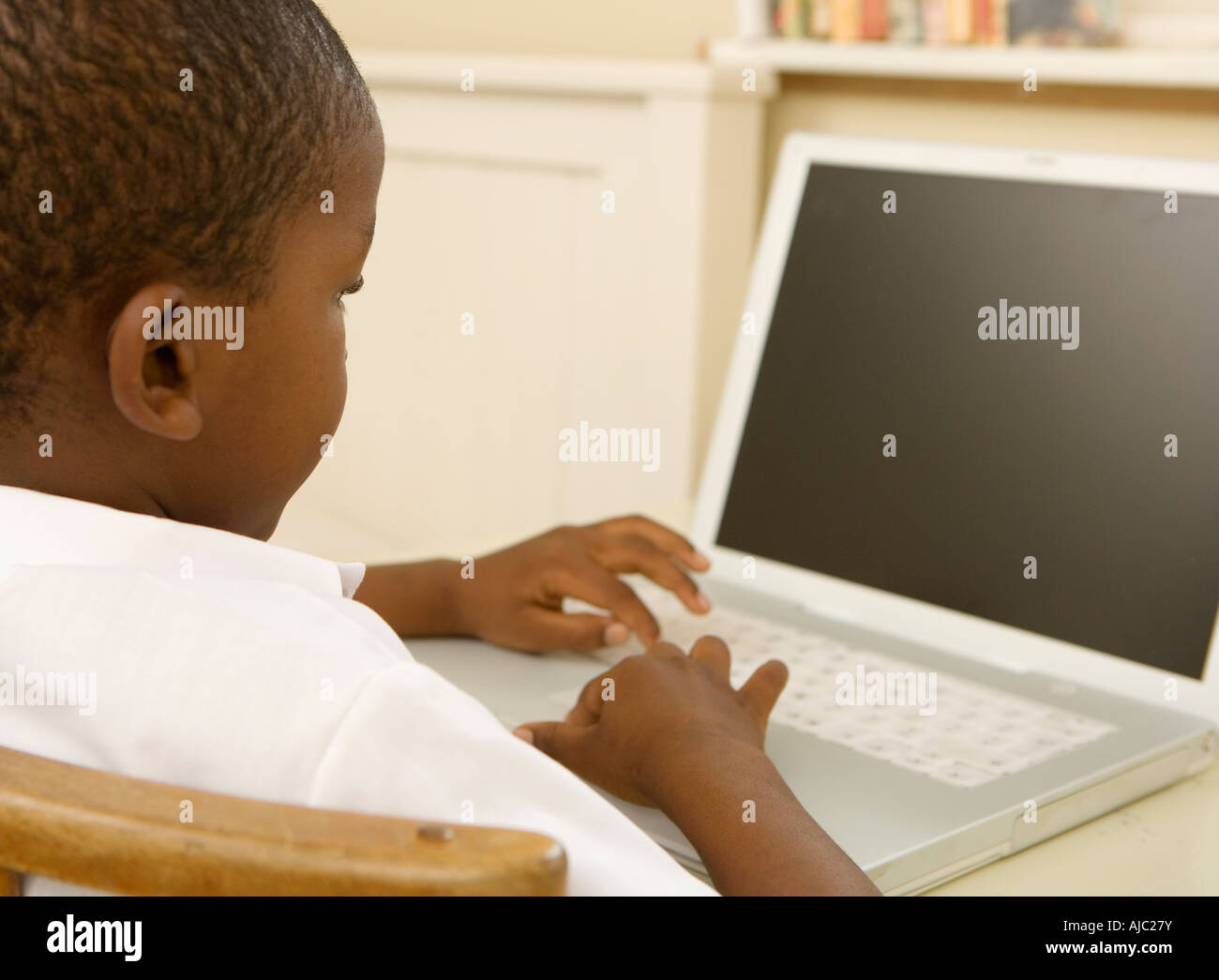 Young African Boy Using a Laptop Computer Stock Photo - Alamy