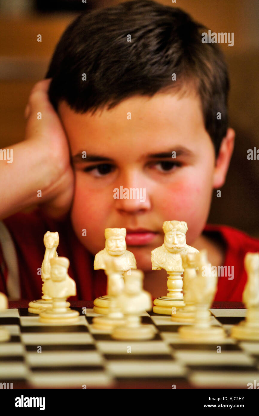 Young Boy Playing Chess Stock Photo - Alamy