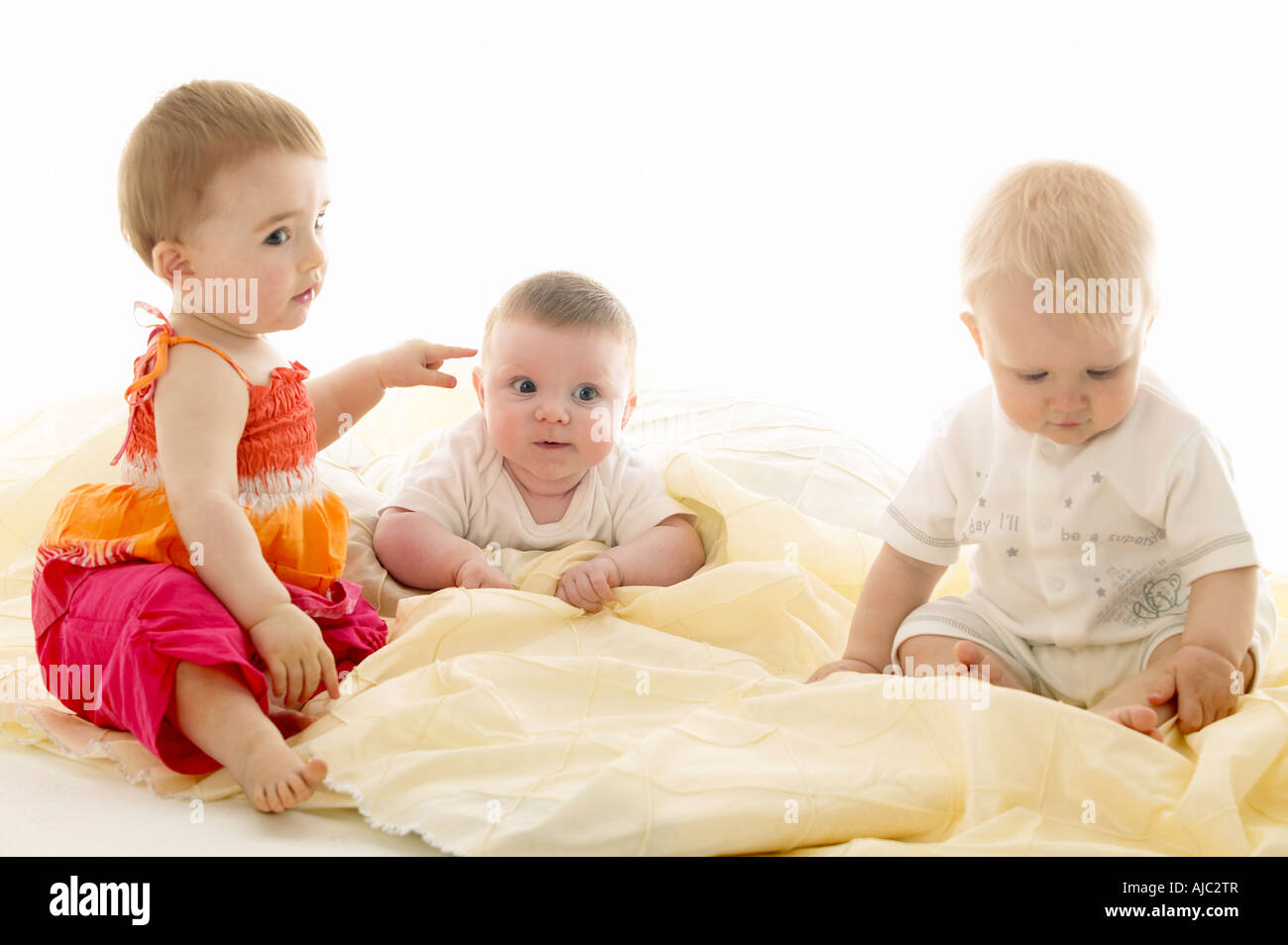 Portrait of Three Babies - Little Girl Pointing Stock Photo - Alamy