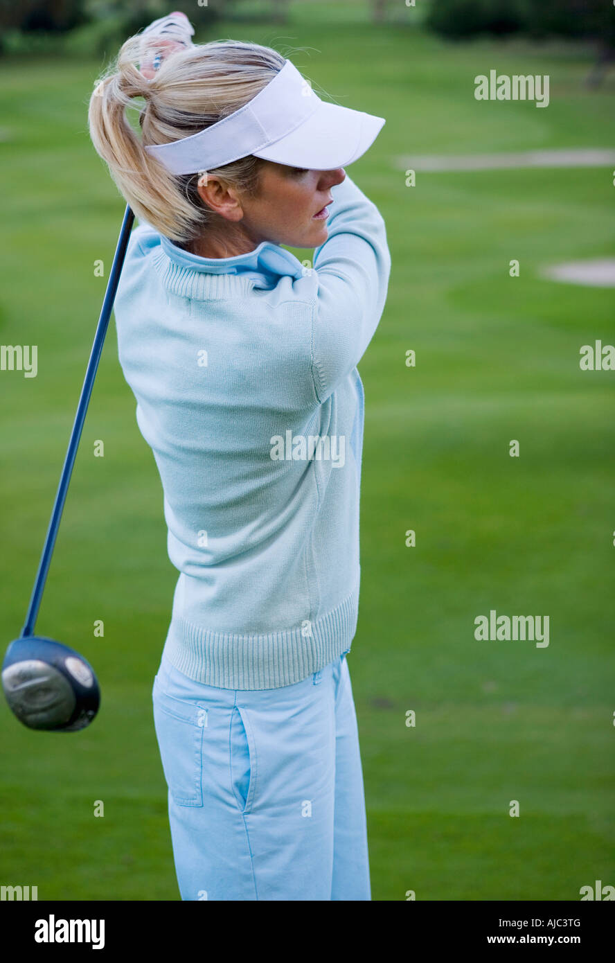 Side View of Woman with Golf club Stock Photo - Alamy