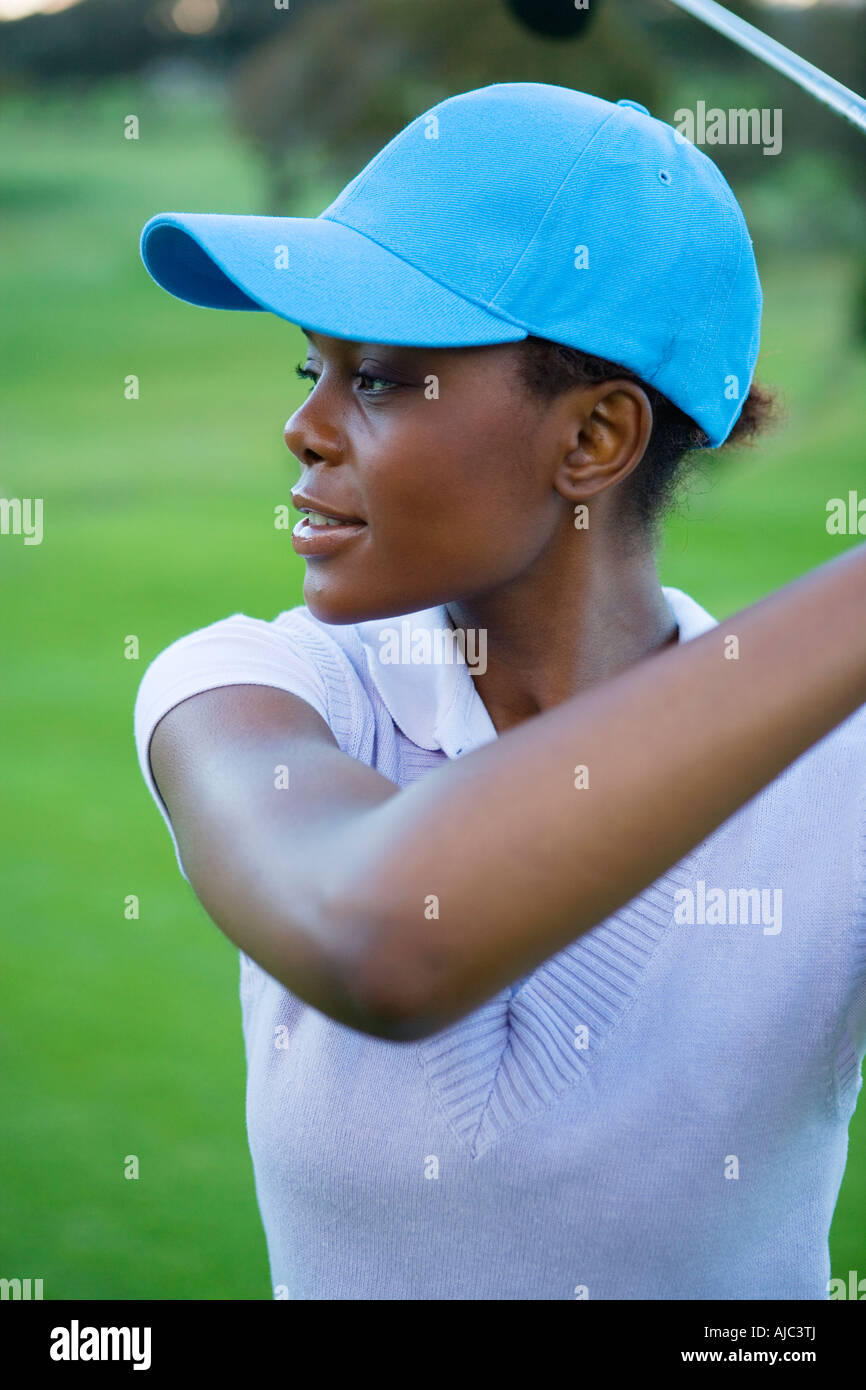 Side View of Woman with Golf Club Stock Photo - Alamy