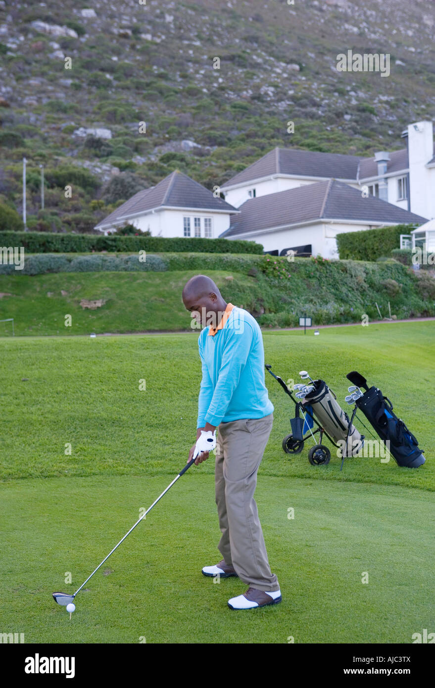 Man Addressing Golf Ball Stock Photo - Alamy