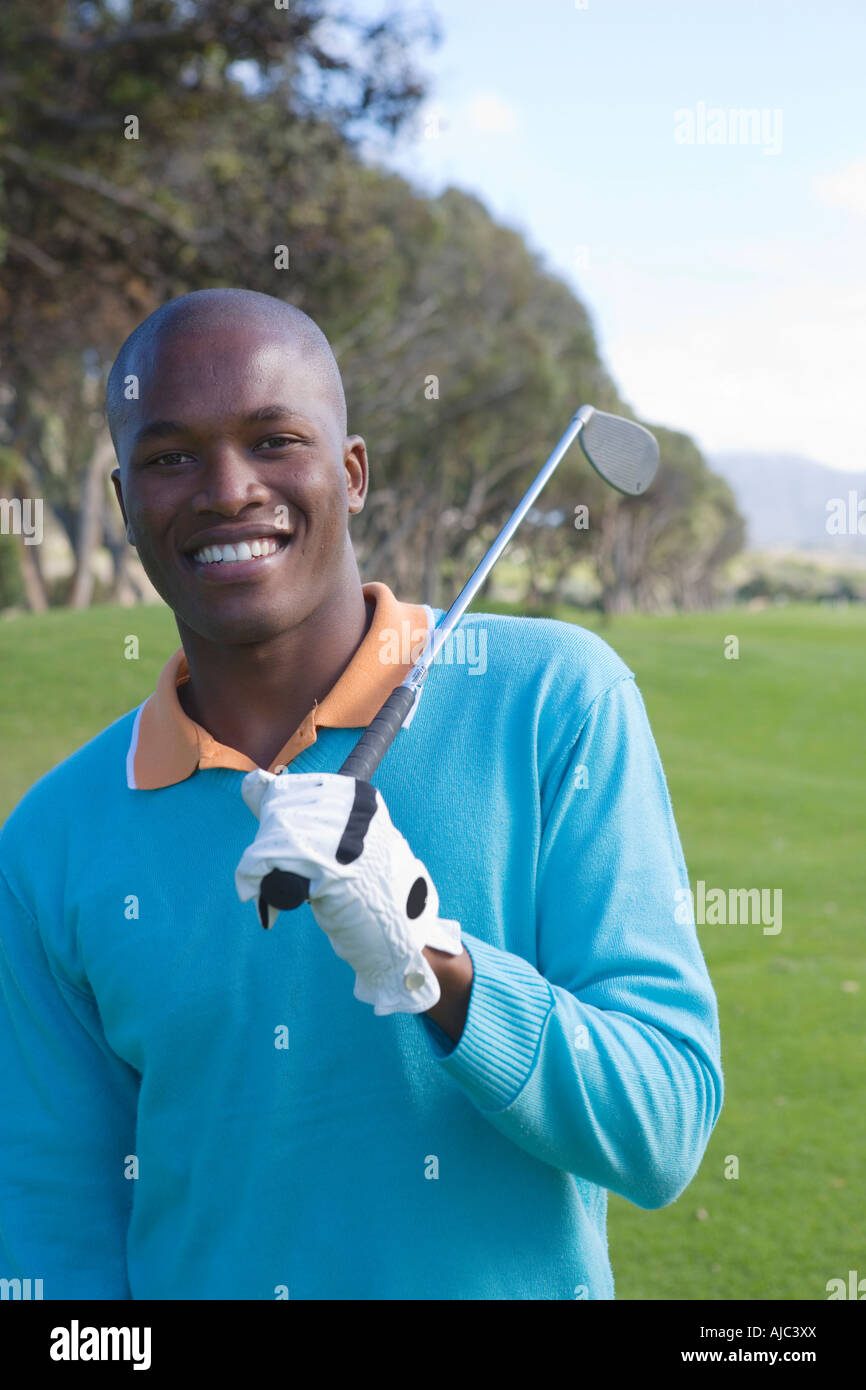 Portrait of Man Holding Golf Club Stock Photo - Alamy