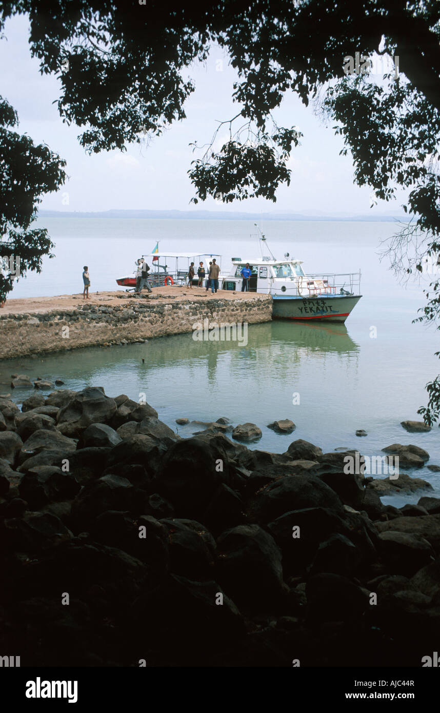 A Boat Docking at the Jetty of an Island Stock Photo - Alamy