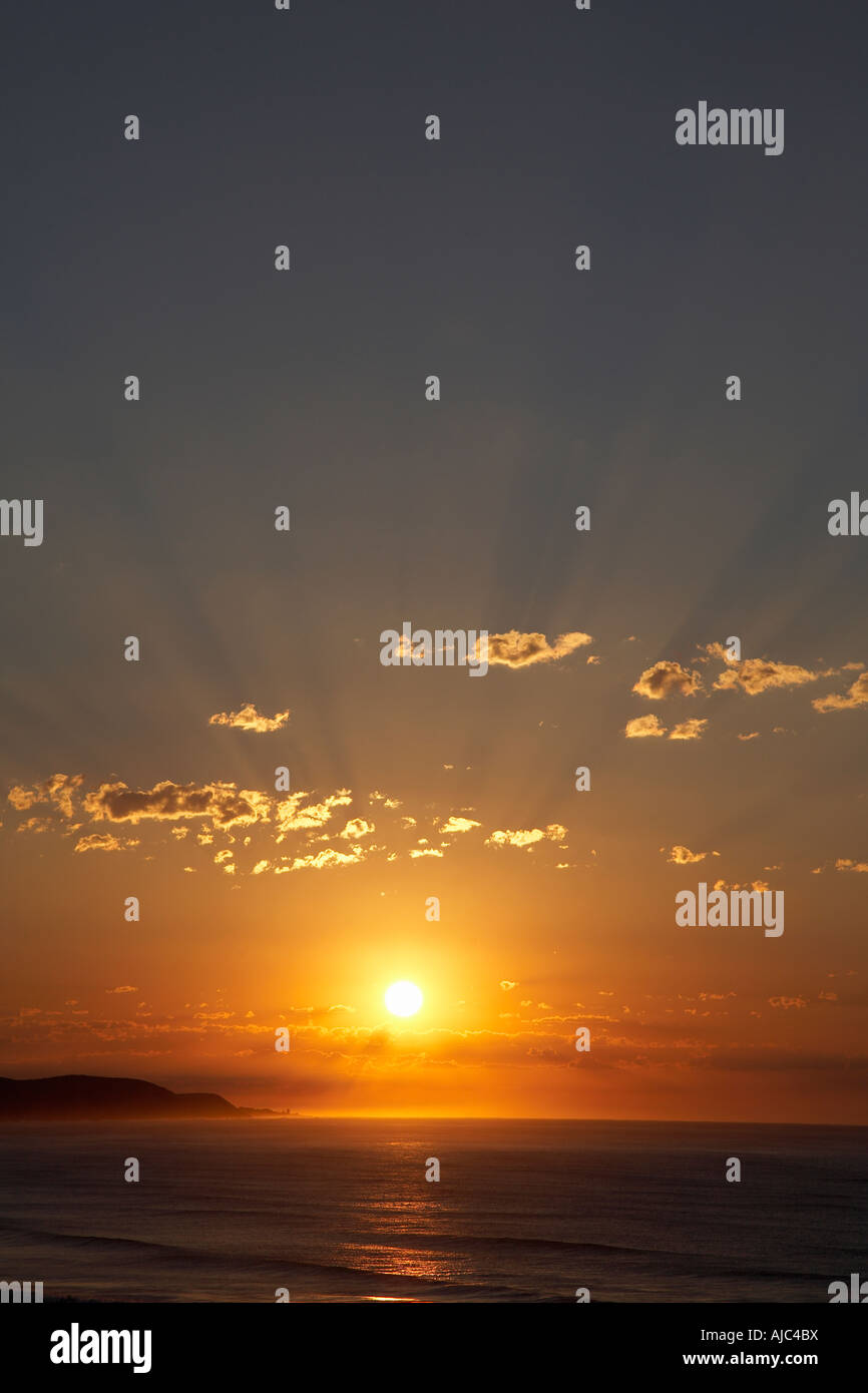View of the Sun Rising Over the Ocean Stock Photo - Alamy