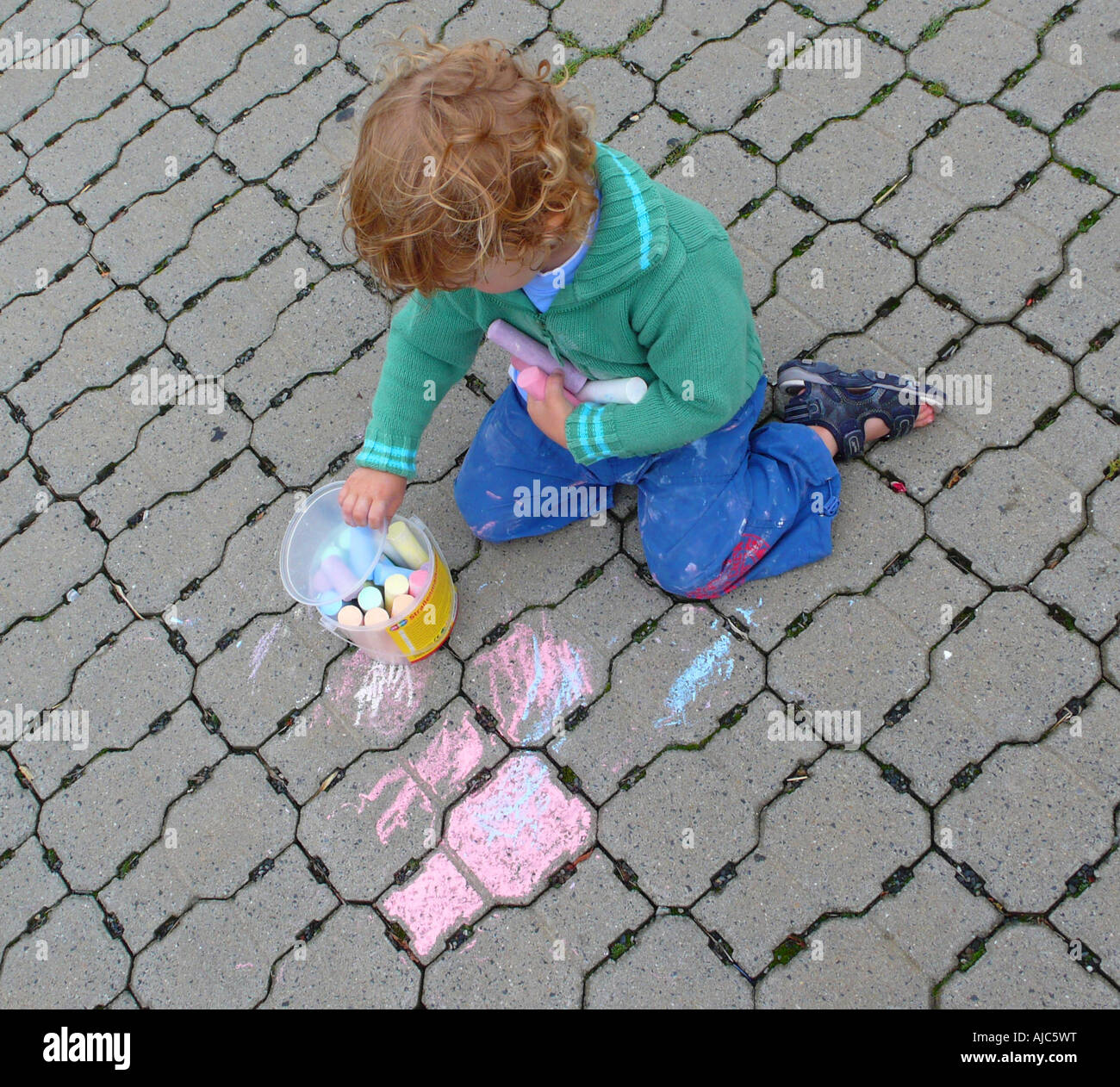little boy playing with crayon Stock Photo - Alamy
