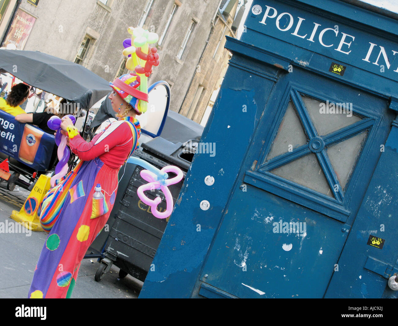 Performer standing next to a blue police box during the Fringe Festival ...