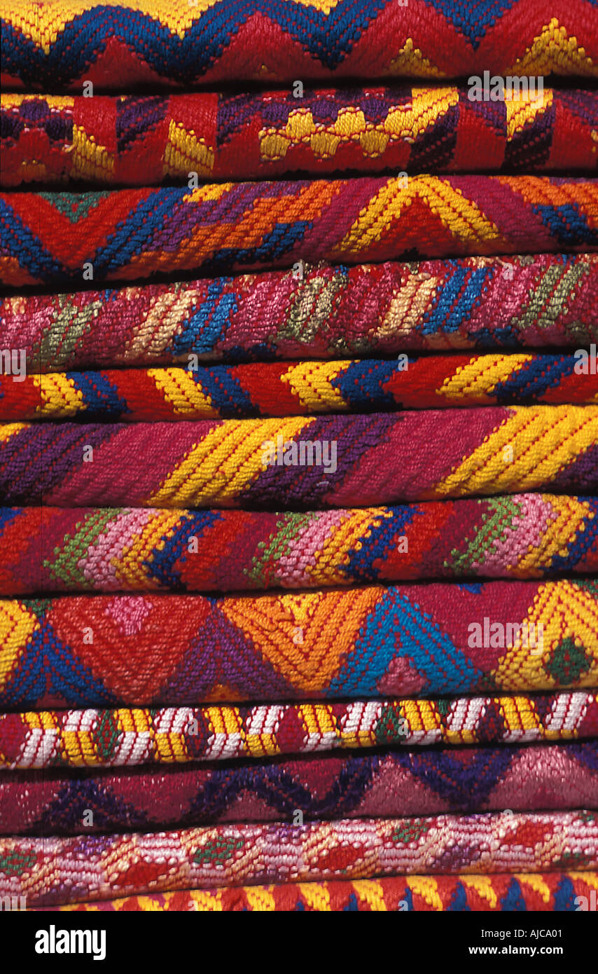 A stack of brightly brocaded textiles from Almolonga Nim Pot store ...