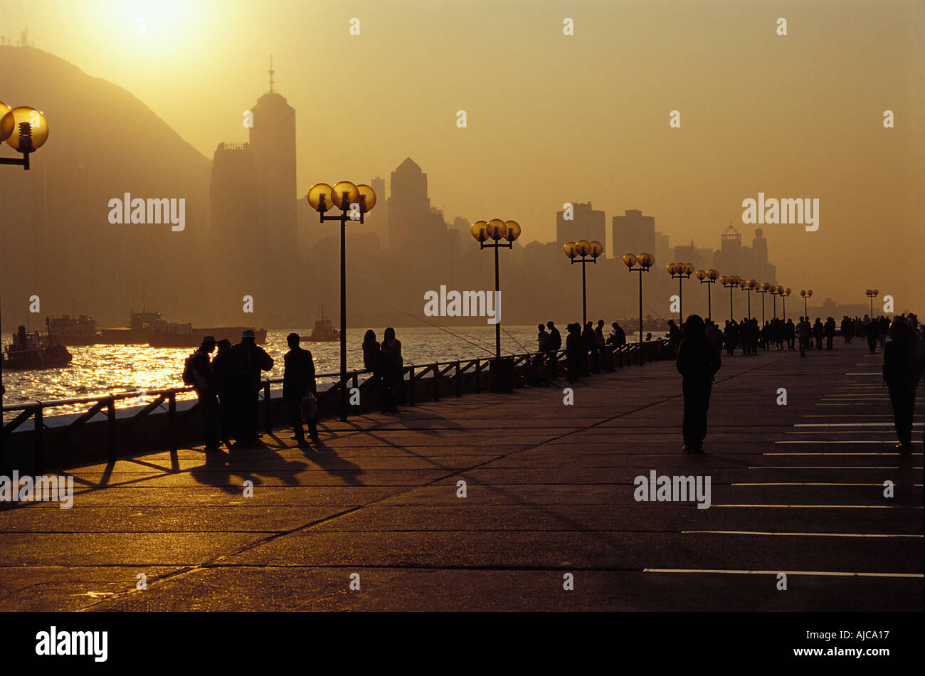 Promenade beside Hong Kong s famous Victoria harbour Sunset scene Stock ...