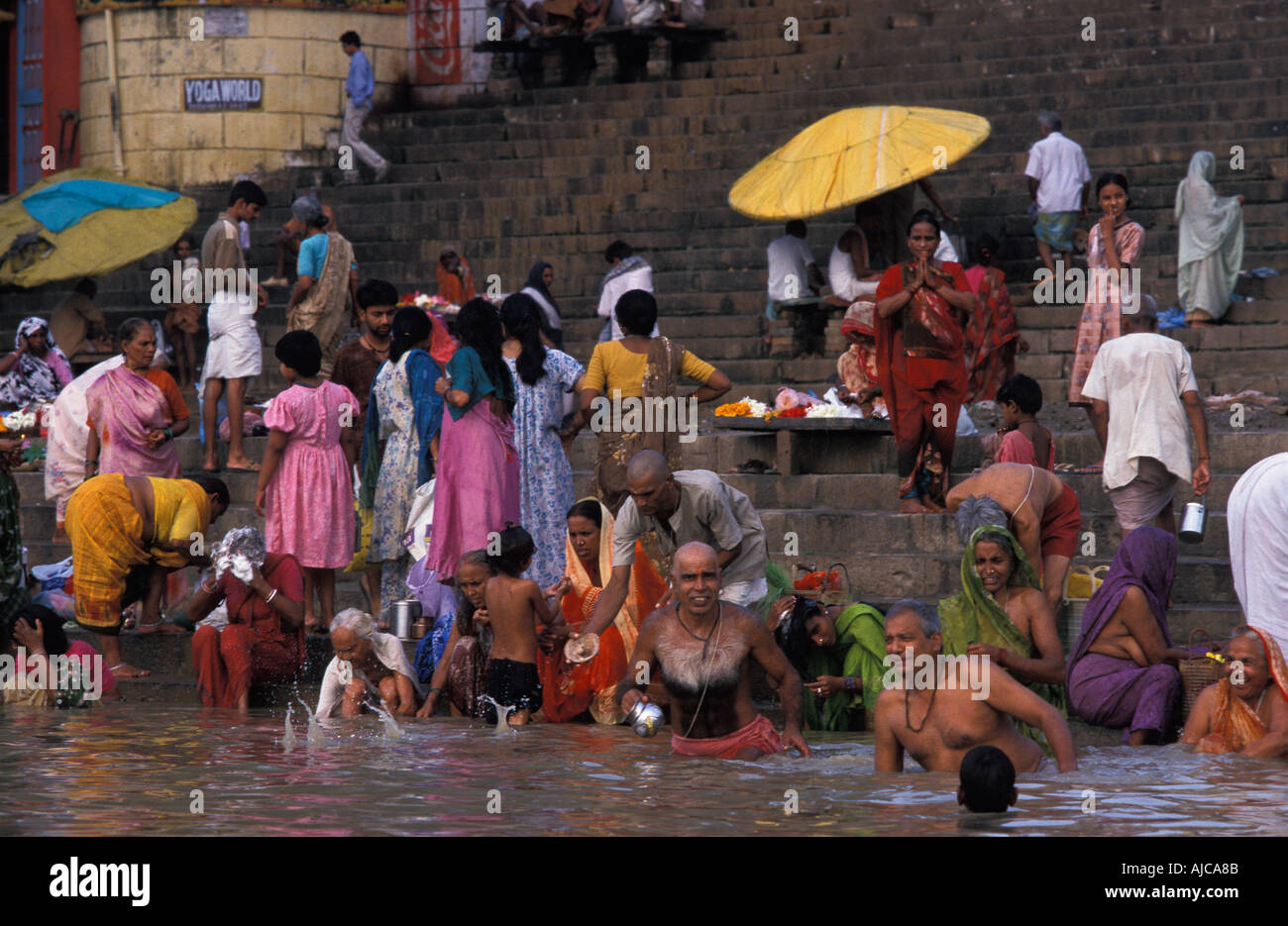Bathing in the holy water of the Ganges river at Varanasi The ghats are ...