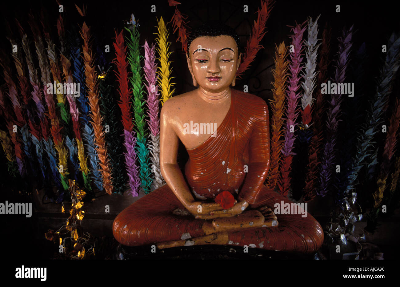 Statue of Buddha Located under a Bodhi tree Pipal Ficus religiosa at ...