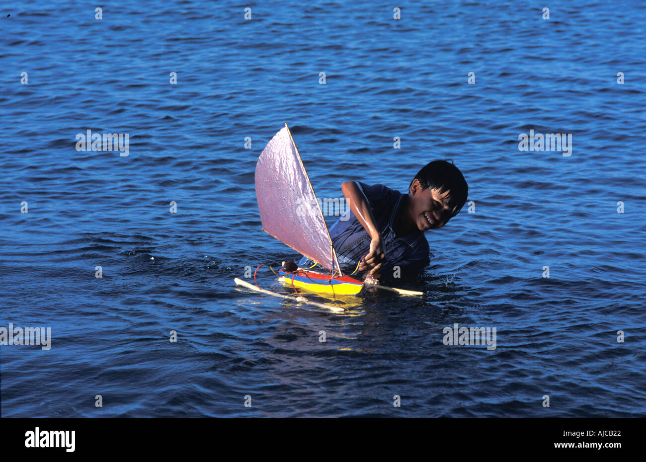 Asian boy fishing boat hi-res stock photography and images - Alamy