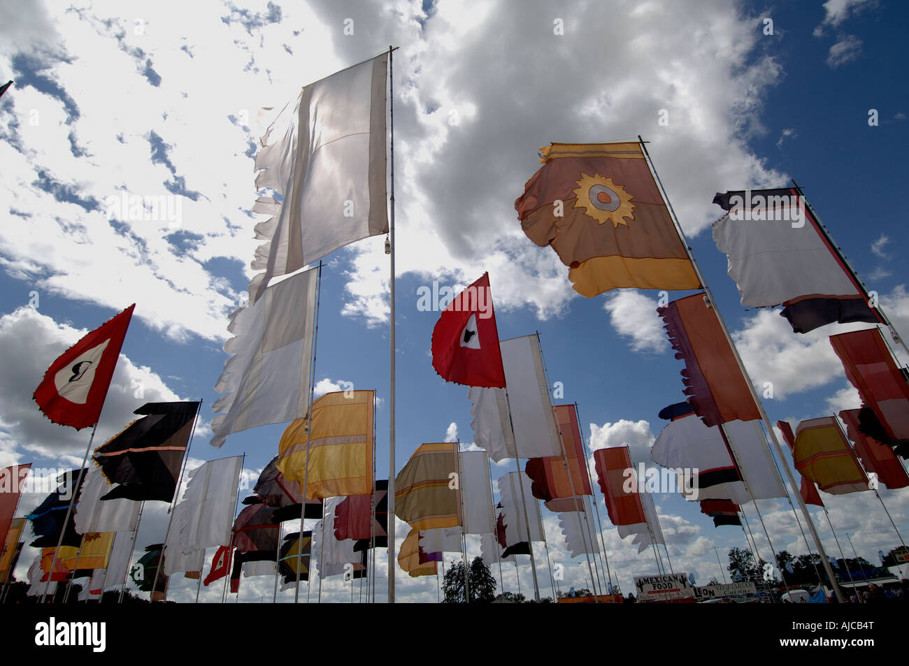 The flags fly at the annial WOMAD festival in Wiltshire Stock Photo - Alamy