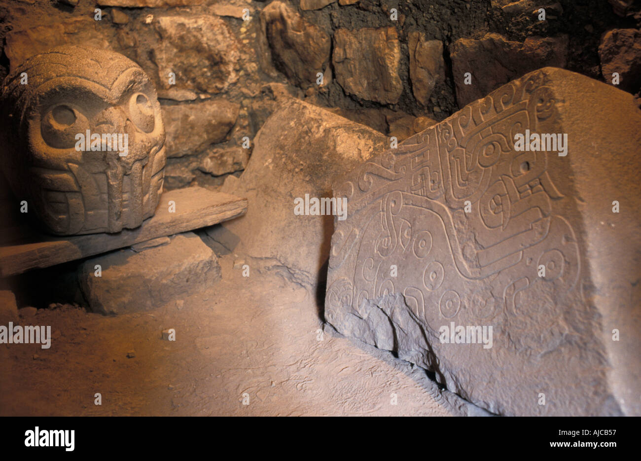 Stone carved head cabeza clava in the subterranean tunnels of Chavin de ...