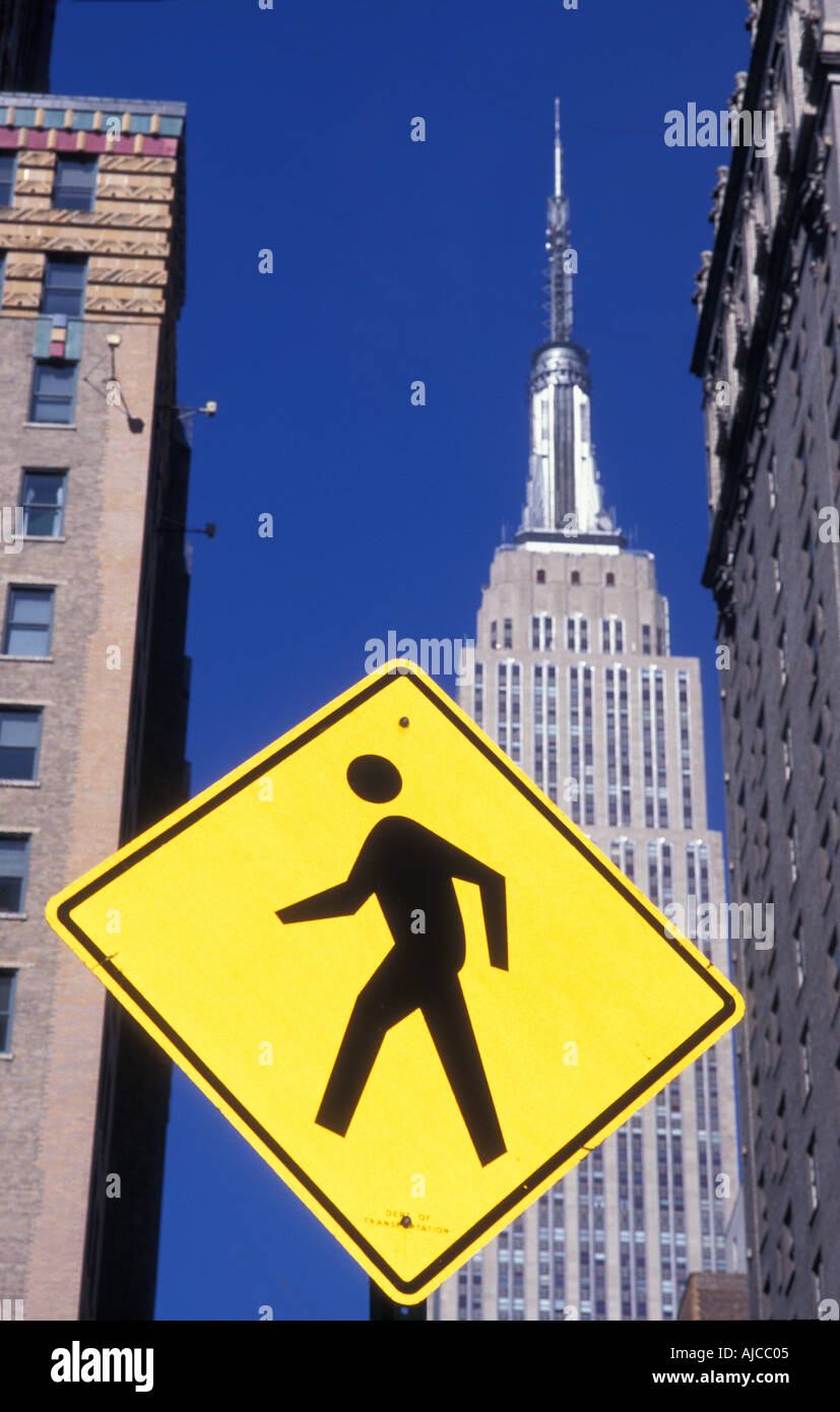 Pedestrian road crossing sign Empire State Building in background ...