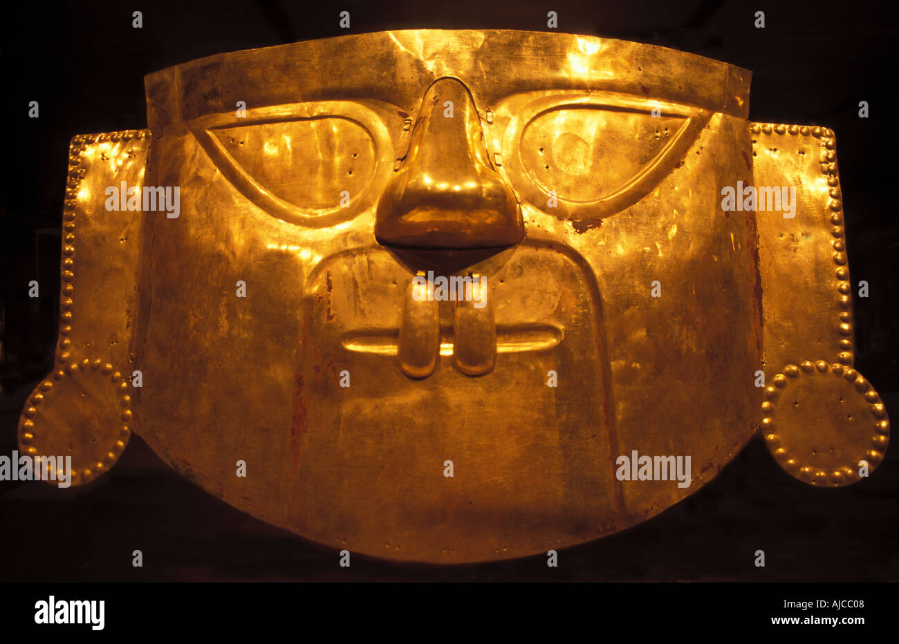 Golden ceremonial Mask from Peru Stylized face with its teardrop eyes ...