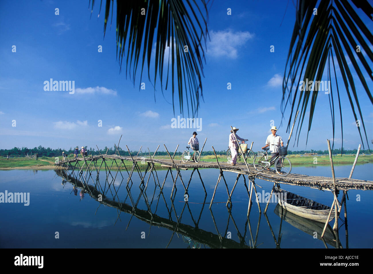 Crossing the bamboo footbridge that spans the Thu Bon River Hoi An ...