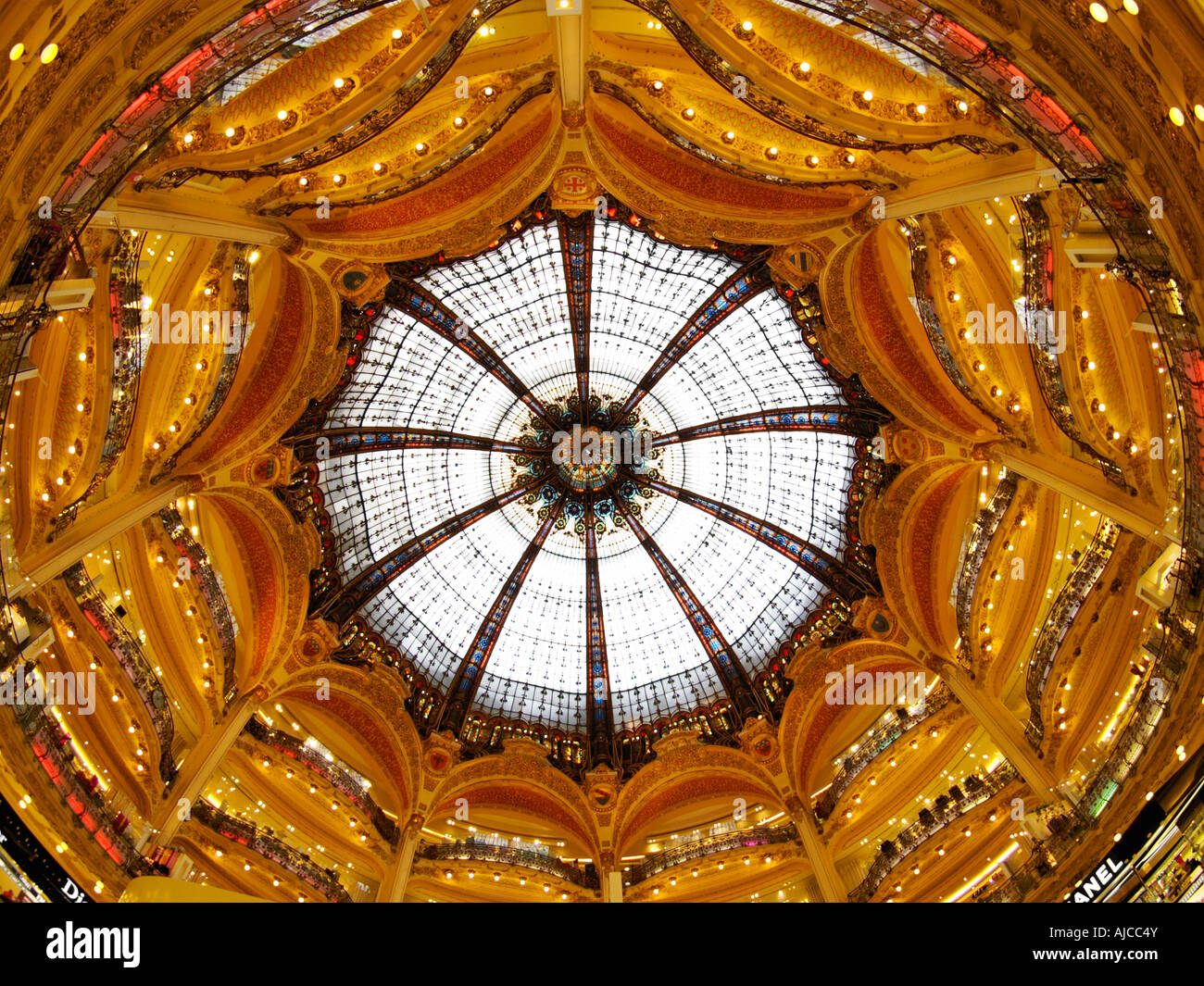 The famous glass dome in the central hall of the Galeries Lafayette ...