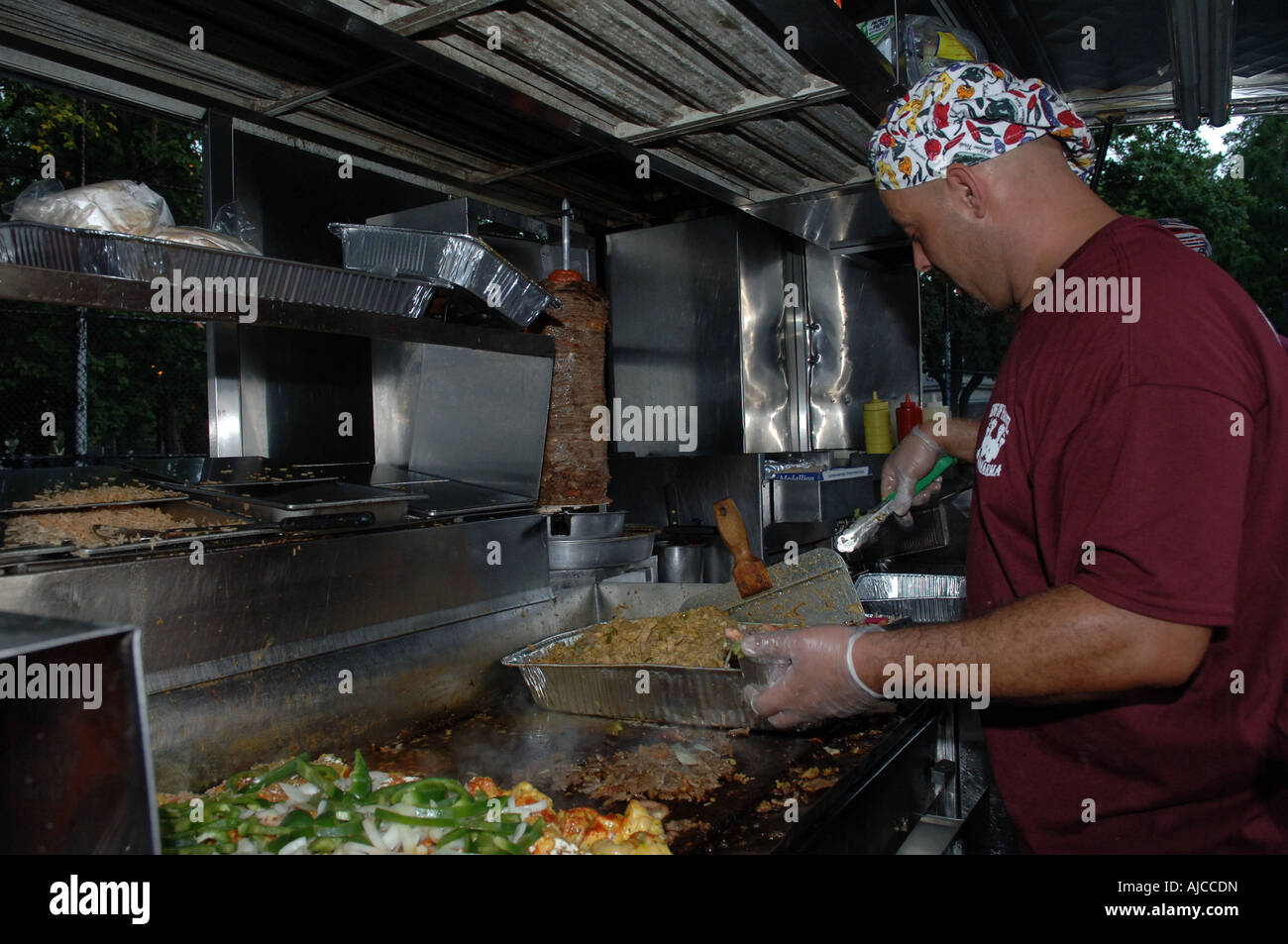A street cart food vendor serves falafel and shawarma Stock Photo - Alamy