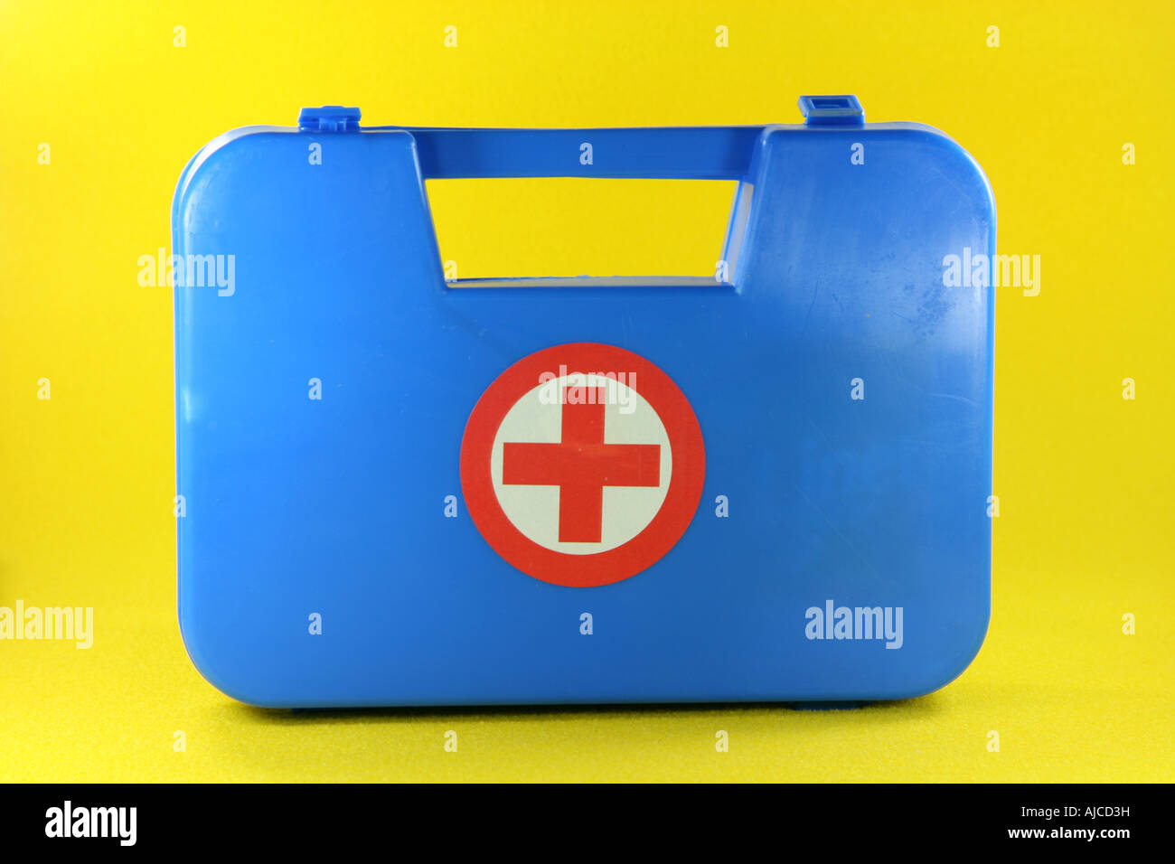 helth and safe concepts first aid box in yellow background Stock Photo ...