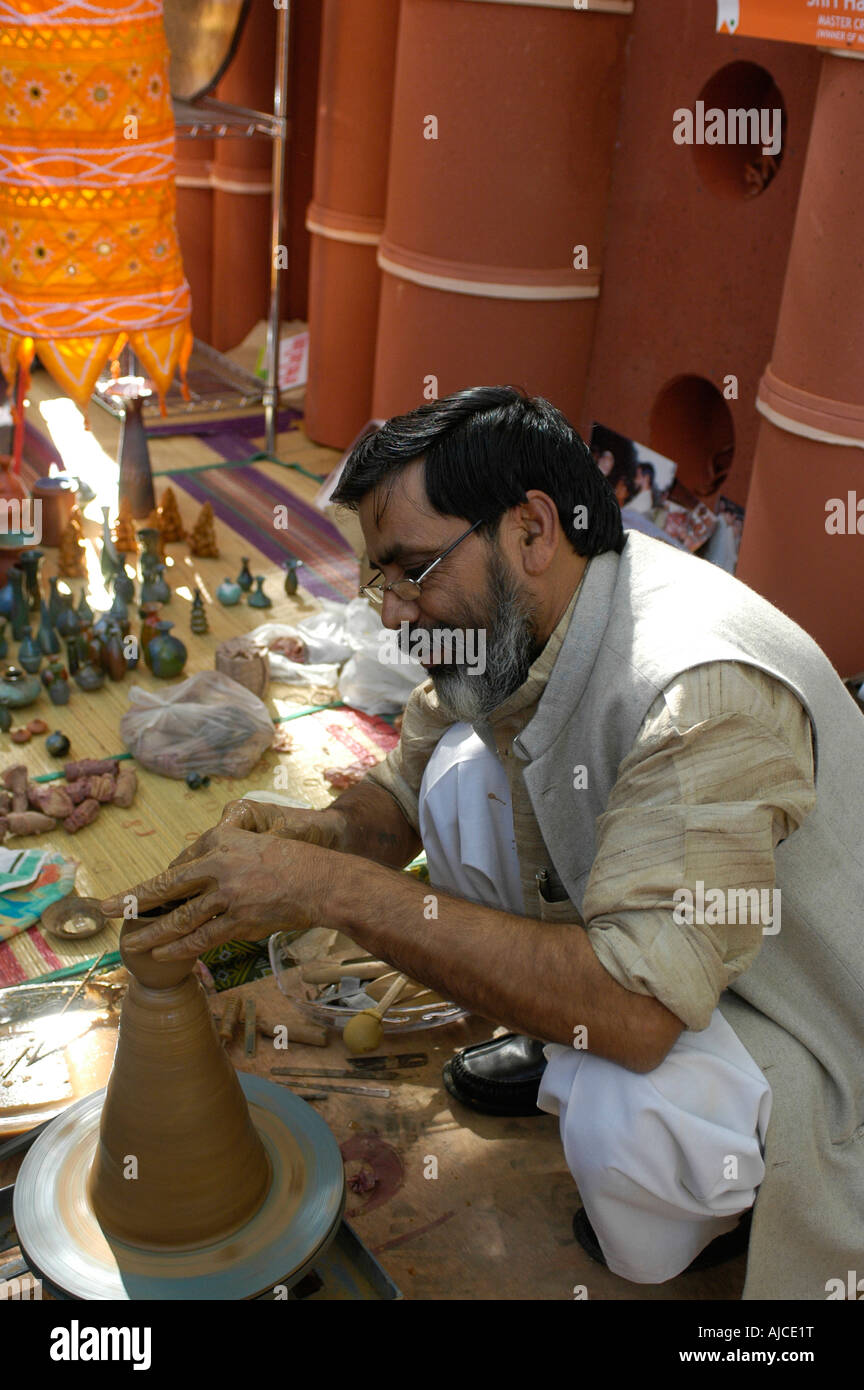 Master potter Shri Har Kishan from India demonstrates throwing a pot in ...