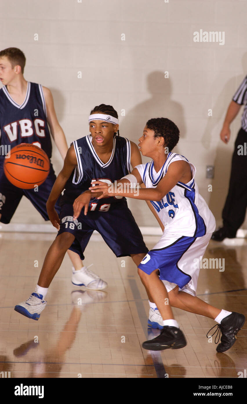 Boys basketball game action Stock Photo - Alamy