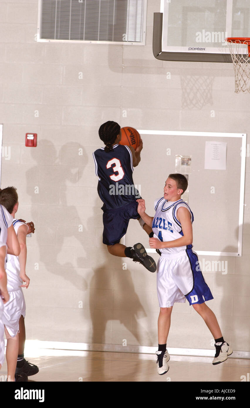 Boys basketball game action Stock Photo - Alamy