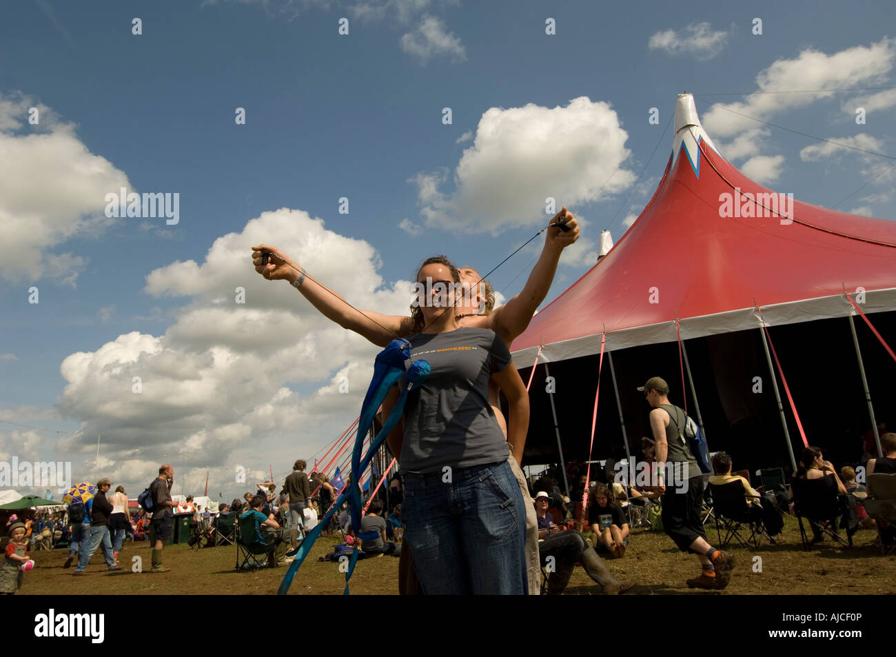 After the rain the sun comes out at WOMAD 2007 so people can dance and ...