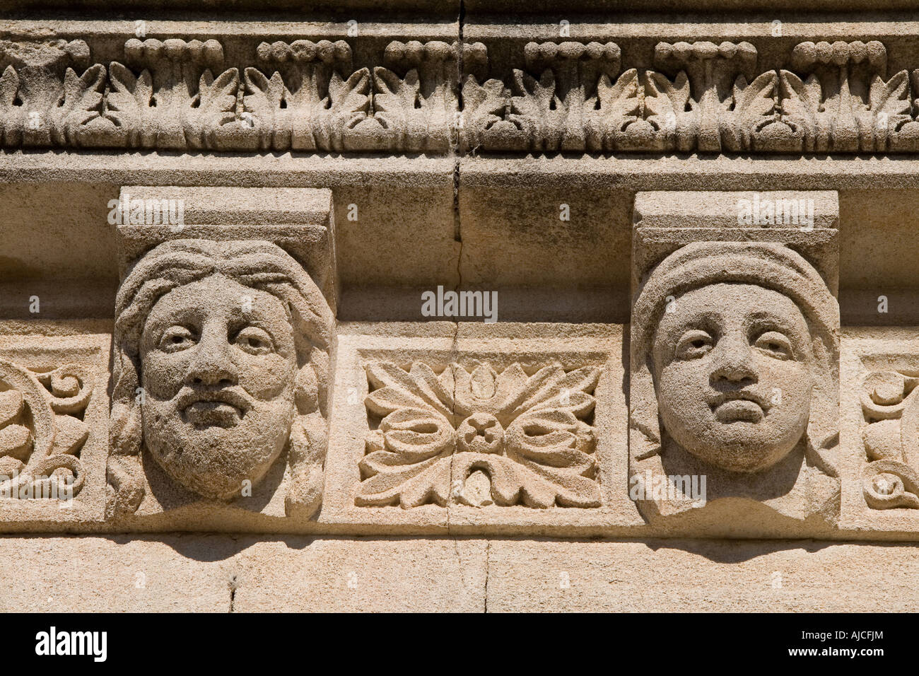Faces of Christian saints carved in stone wall Stock Photo - Alamy