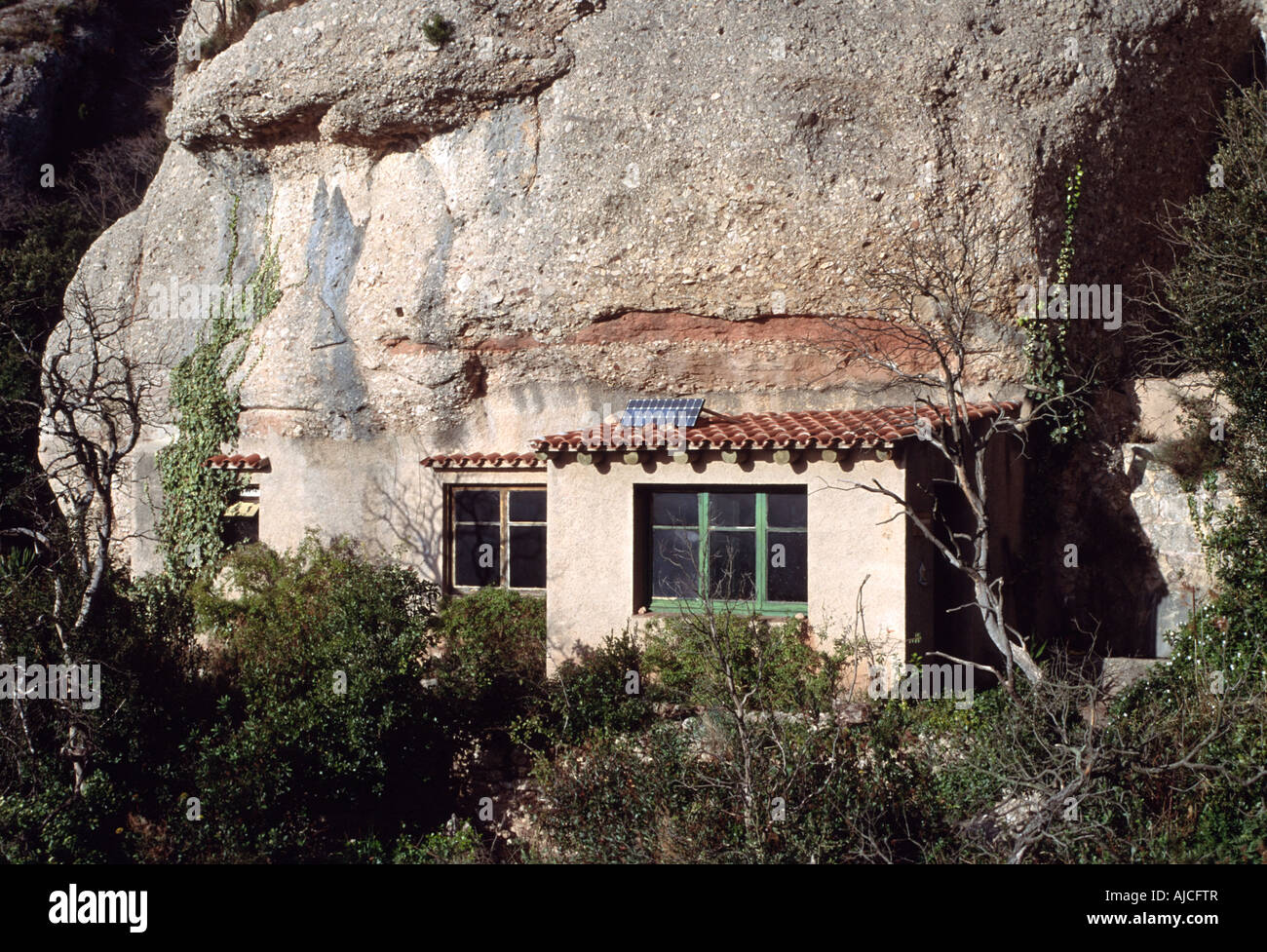 Christian hermitage built into a rock face, Mount Monserrat, Catalonia ...