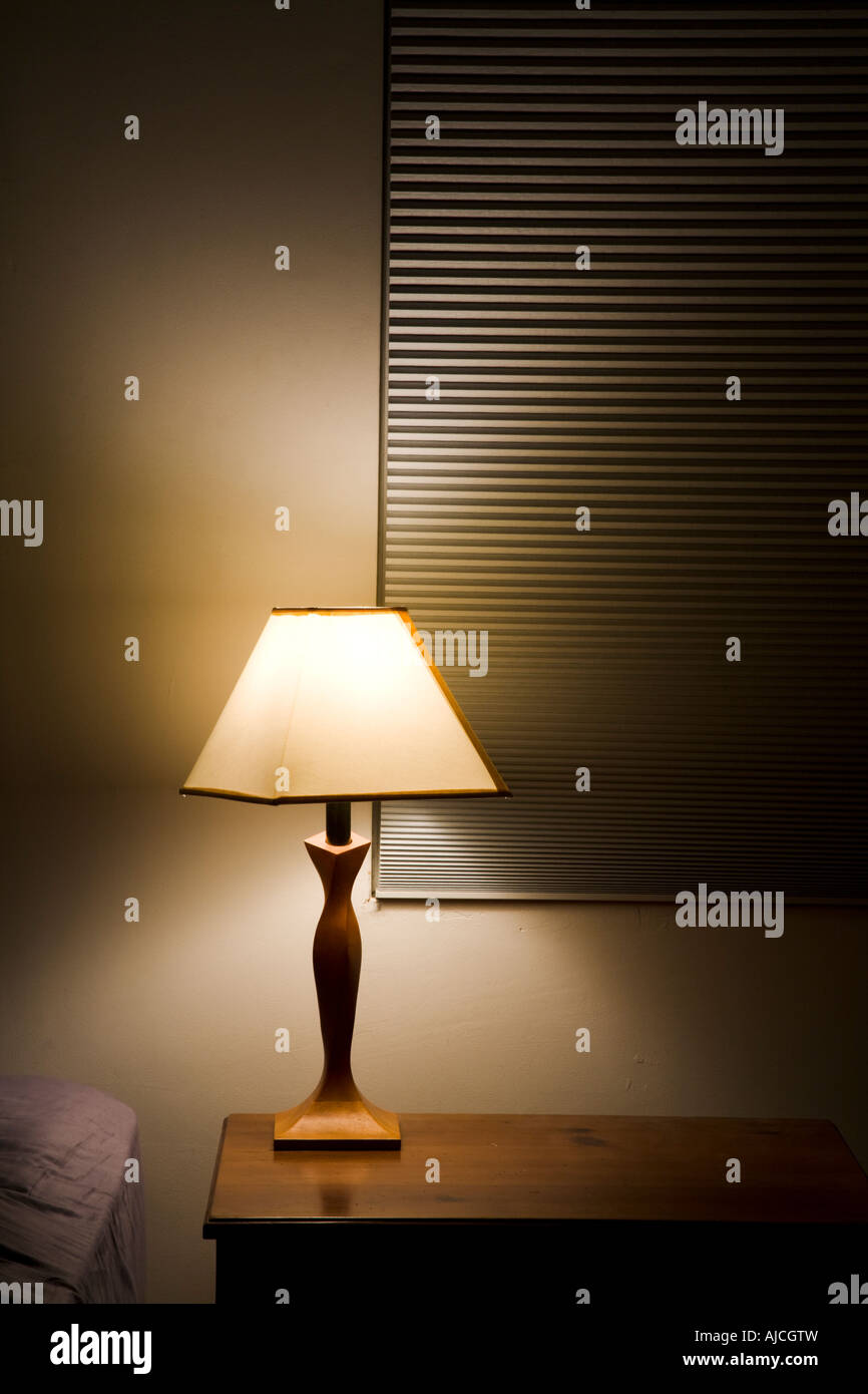 Lamp on a nightstand in a bedroom property released Stock Photo - Alamy