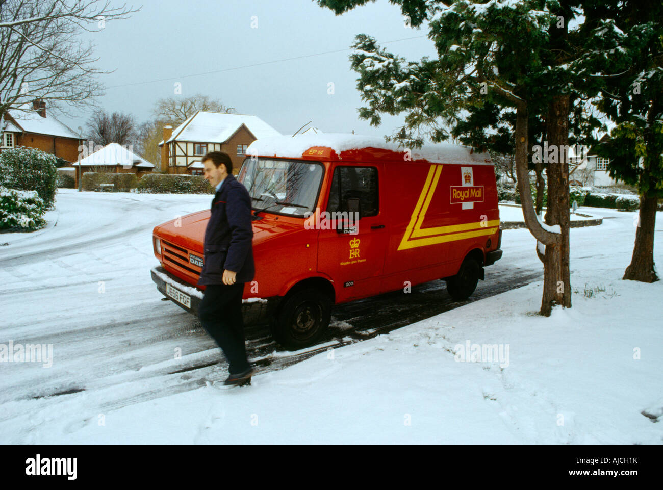 Postman delivering snow hi-res stock photography and images - Alamy