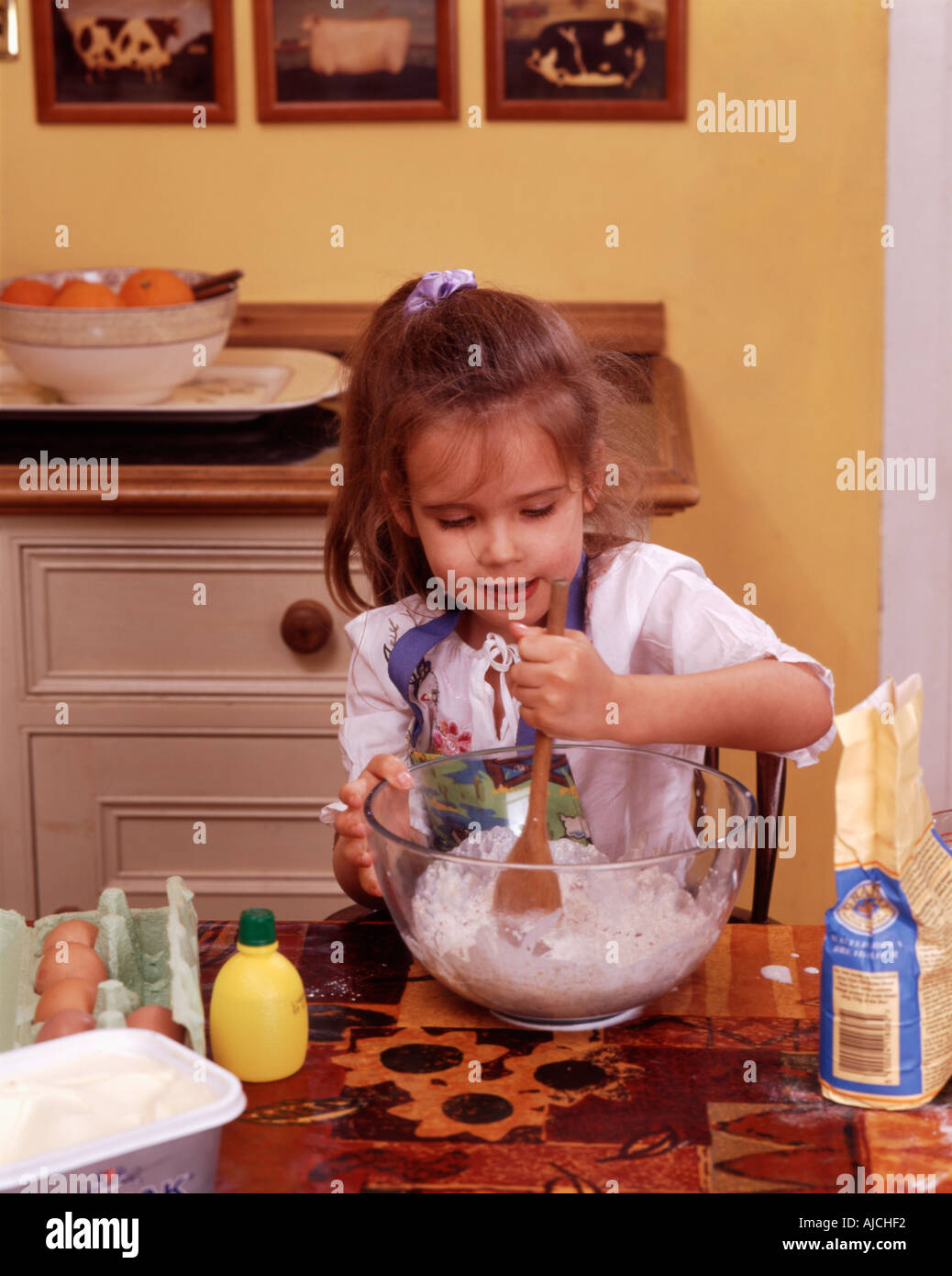Child Baking a Cake in the Kitchen at Home Stock Photo - Alamy