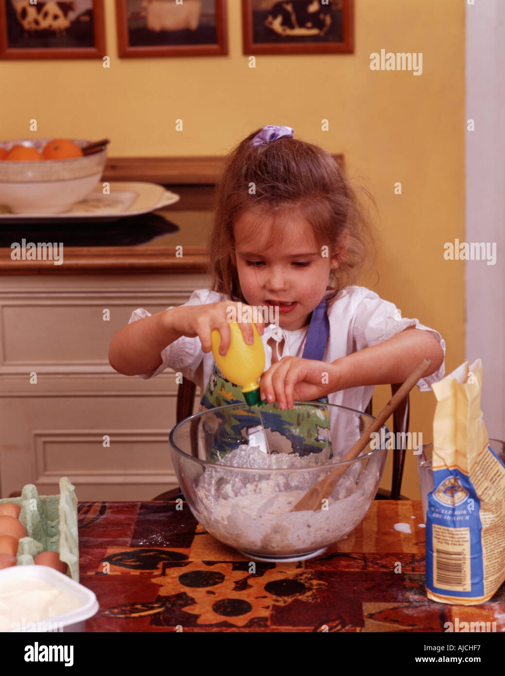 Child Baking a Cake in the Kitchen at Home Stock Photo - Alamy