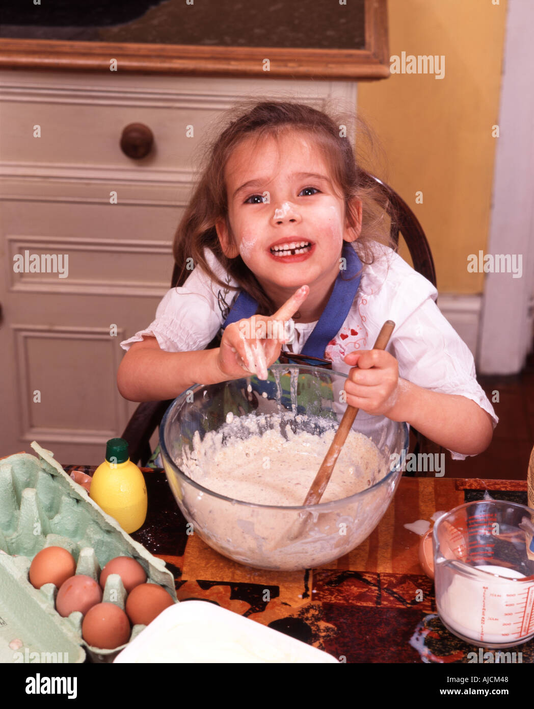 Child Baking a Cake in the Kitchen at Home Stock Photo - Alamy