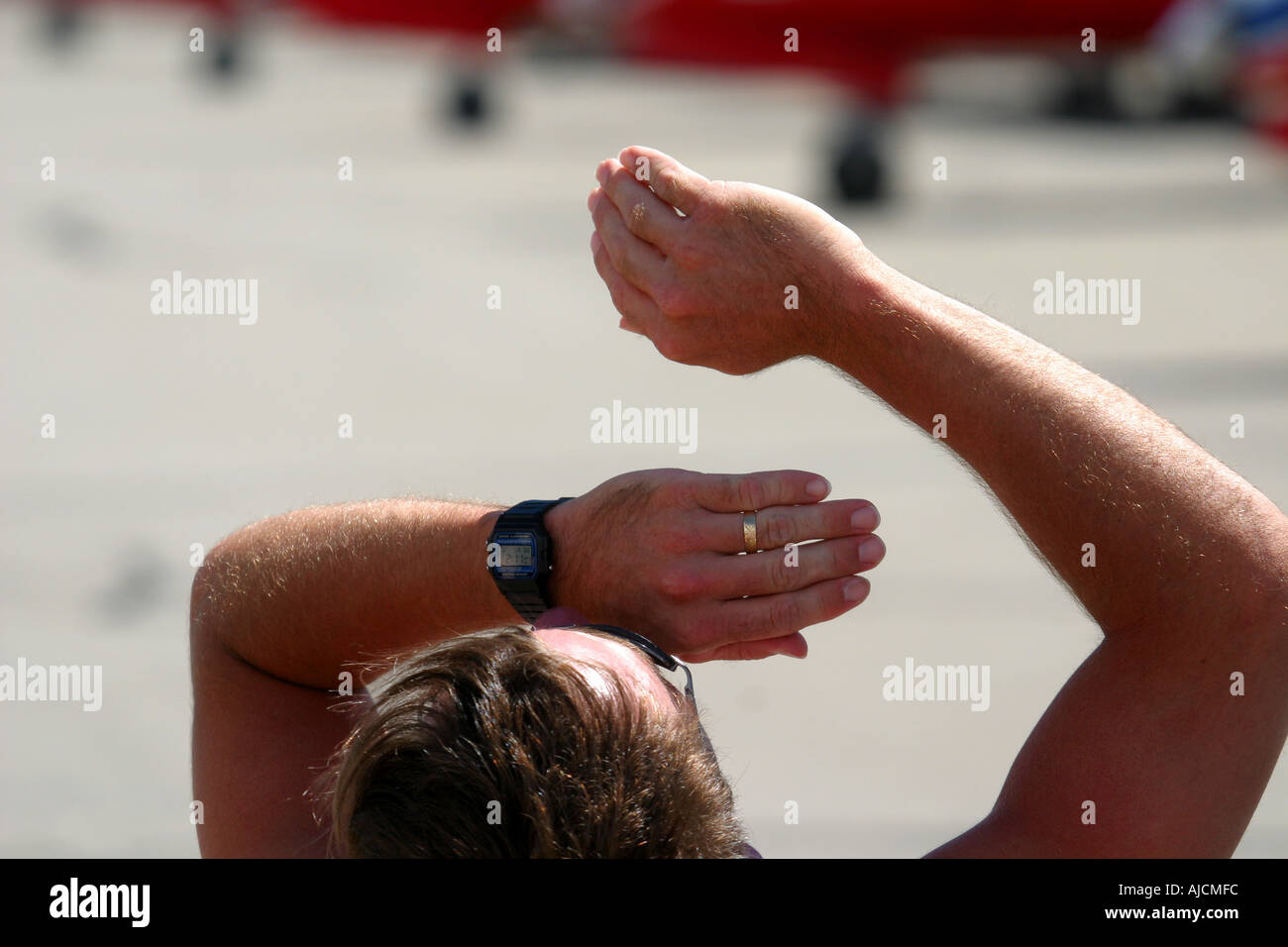 AIR SHOW, AIR SHOW spectator shielding eyes from the sun Stock Photo ...