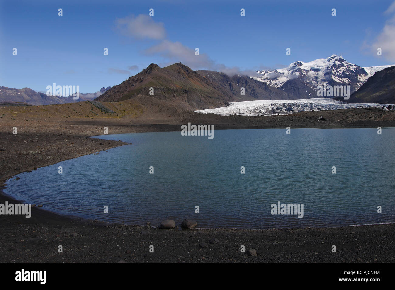 A glacial lagoon in the terminal moraine of the Svinafell glacier below ...