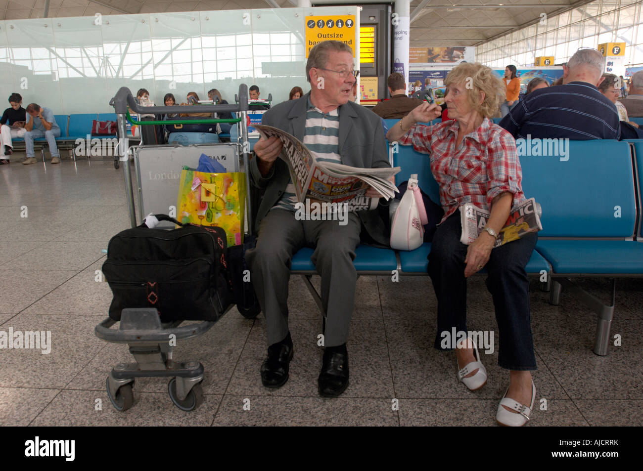 Waiting at a UK airport London Stansted Stock Photo - Alamy