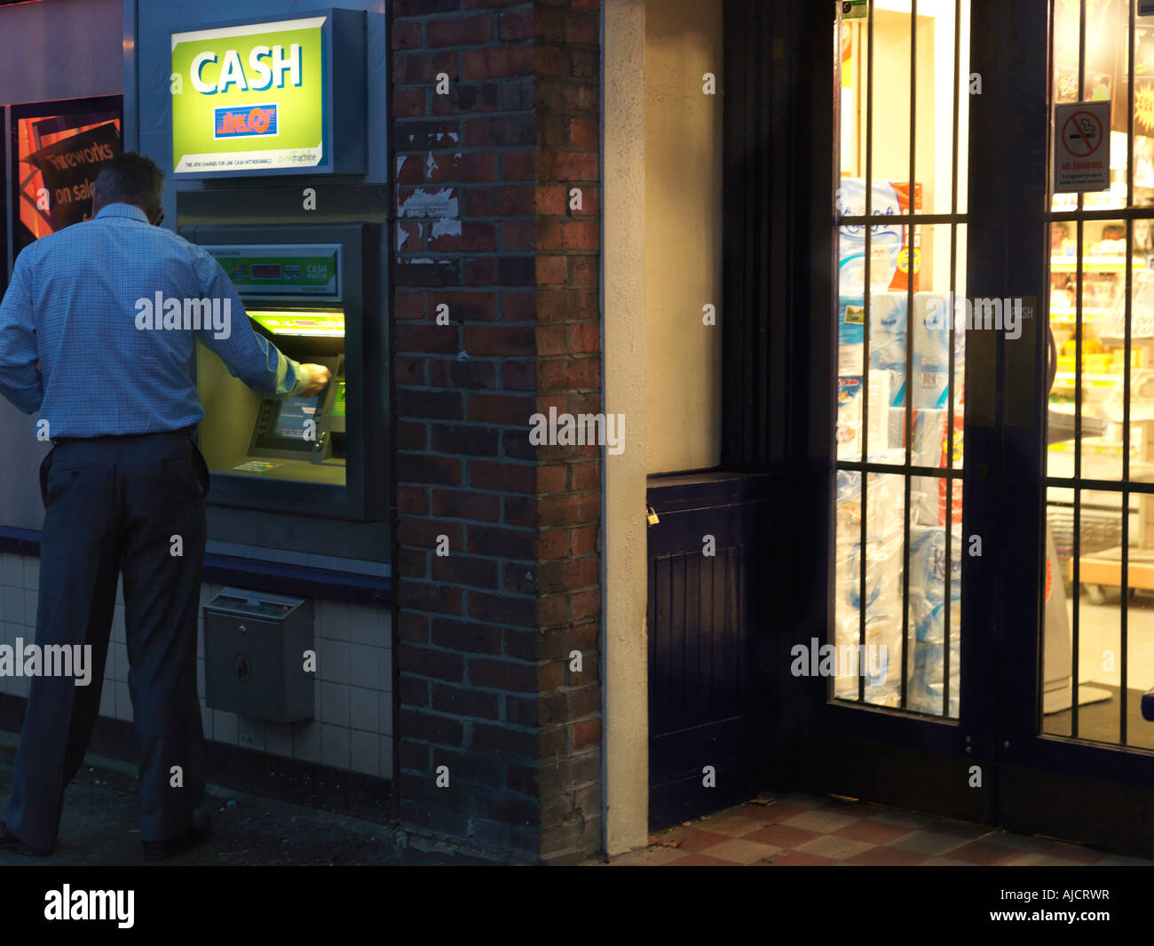 ATM in use Nork Surrey Stock Photo - Alamy