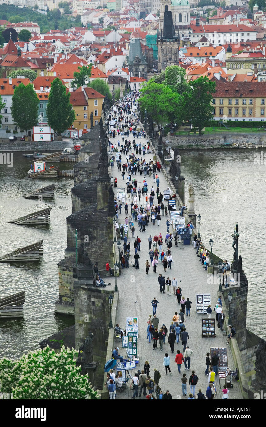 Tourist making their way across the Charles Bridge crossing the Vltava ...