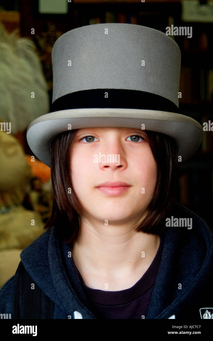 Eccentric young boy wearing an old top hat Stock Photo - Alamy