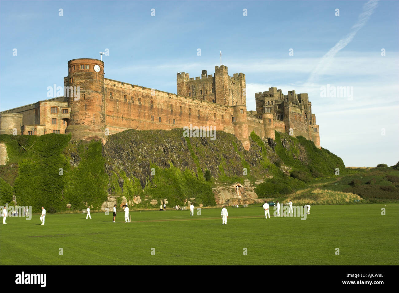 Bamburgh Castle standing on a basalt outcrop on the very edge of the ...