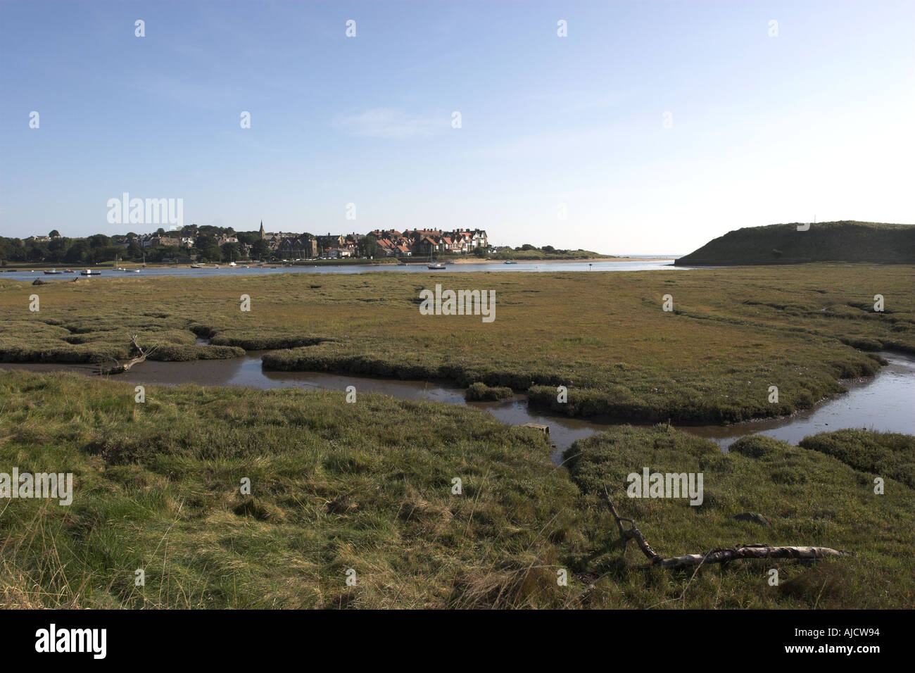 Town of Alnmouth Northumberland as seen across the salt marsh at low ...