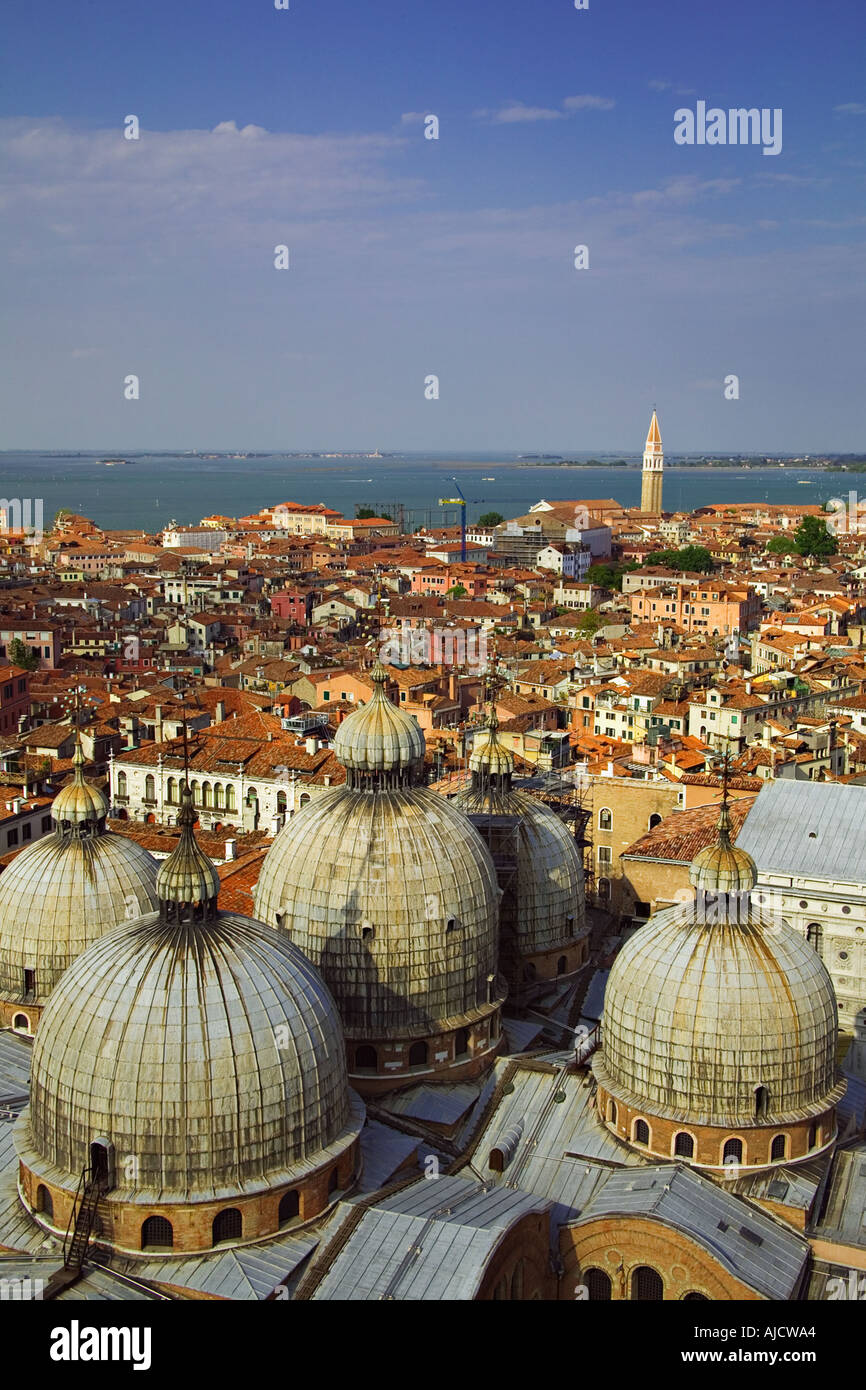 View of Venice rooftops with the domes of Basilica San Marco in the ...